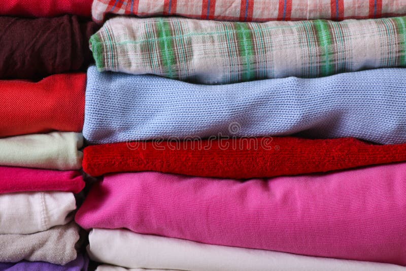 Pile of colorful clothes stock photo. Image of fabric - 40282394
