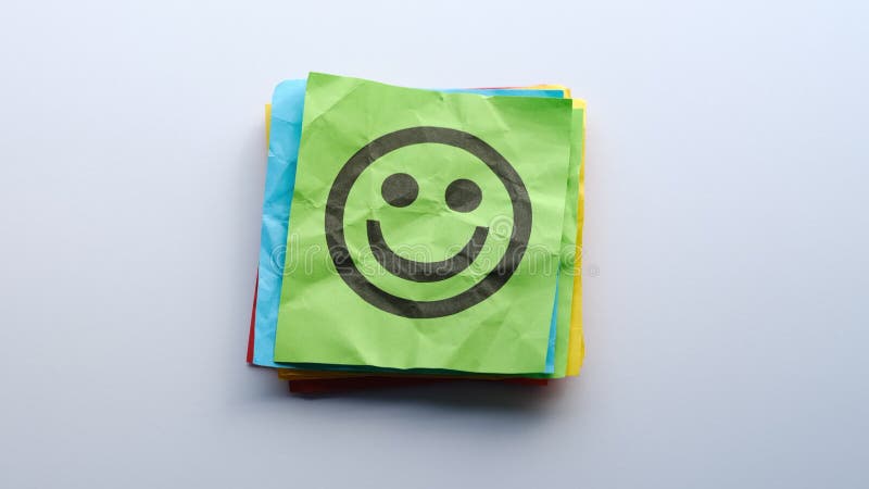 A Pile of Colorful Paper Notes with a Happy Face on One of Them. Stock ...