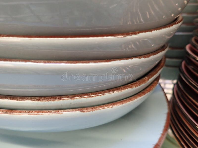 Pile of Colorful Plates in Kitchen Stock Image - Image of eating, knife ...