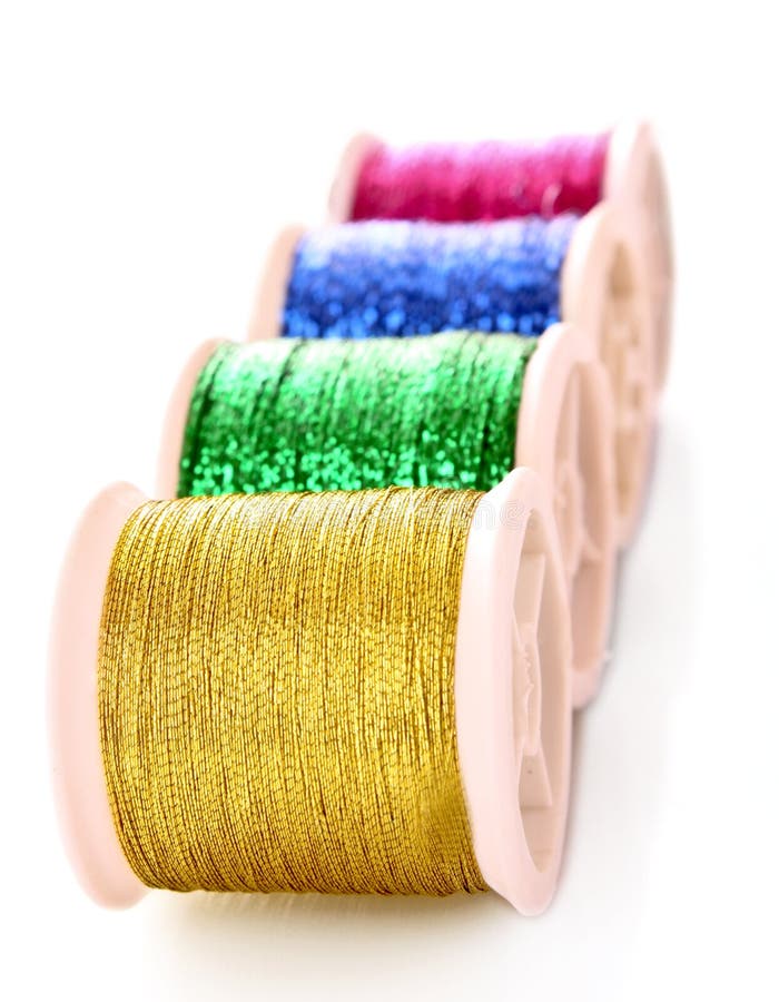 Pile of Coloured Bobbins of Lurex Thread Isolated Stock Photo - Image ...