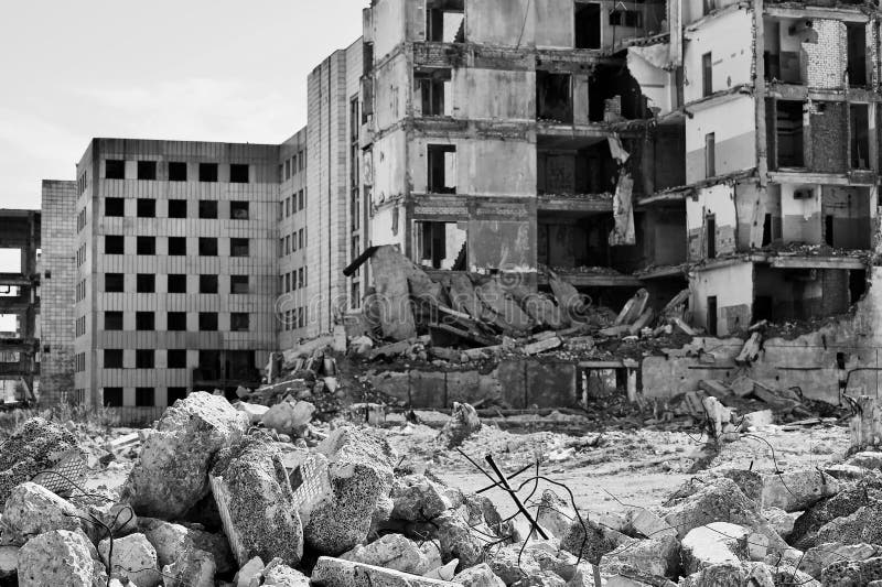 A Pile of Concrete Debris on the Background of a Large Destroyed ...