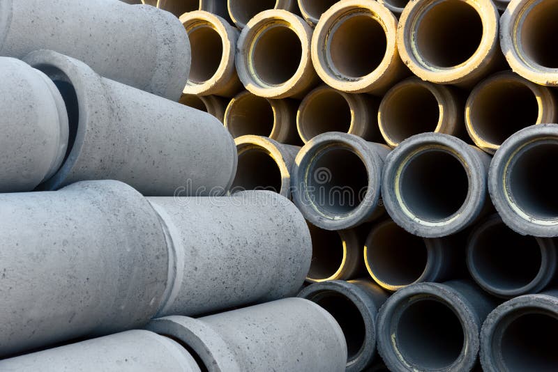 Pile of concrete pipes stock photo. Image of tubes, sewer - 55579614