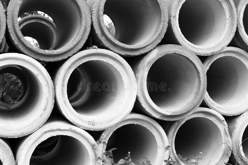 Pile of Concrete Sewer Pipes on Concrete Plant Grounds Stock Image ...