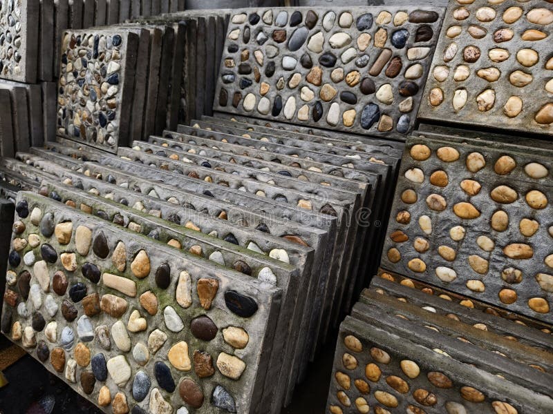 A Pile of Concrete Tiles Filled with Rocks on Top Stock Photo - Image ...