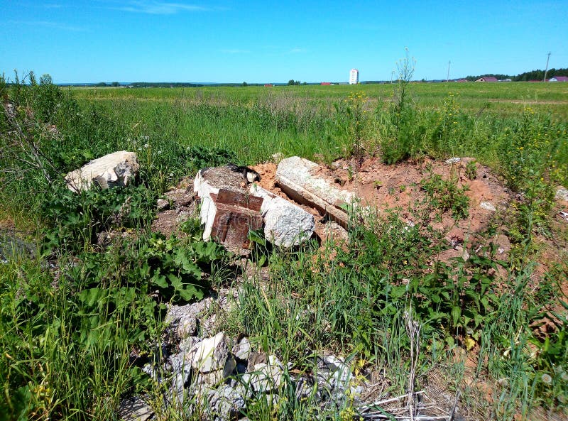 A Pile of Construction Debris in the Middle of a Field Stock Image ...