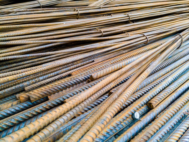 A Pile of Construction Steel Laying on the Ground Near a Construction ...