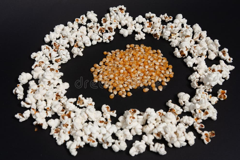 A Pile of Corn Kernels in the Middle of a Ready-made Popcorn Circle. Stock Image - Image of ...