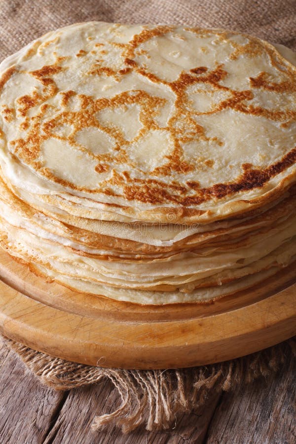 Pile of Crepes on a Kitchen Board on the Table. Horizontal Stock Image ...