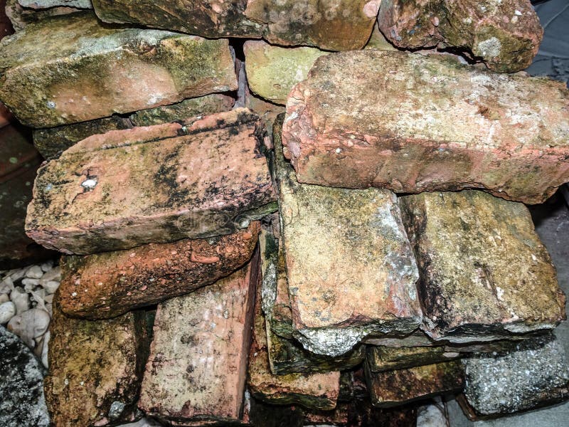 Pile of crumbling bricks stock photo. Image of heap - 104058856
