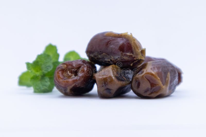 Pile of Dates with Green Leaf Garnish Stock Image - Image of poster ...