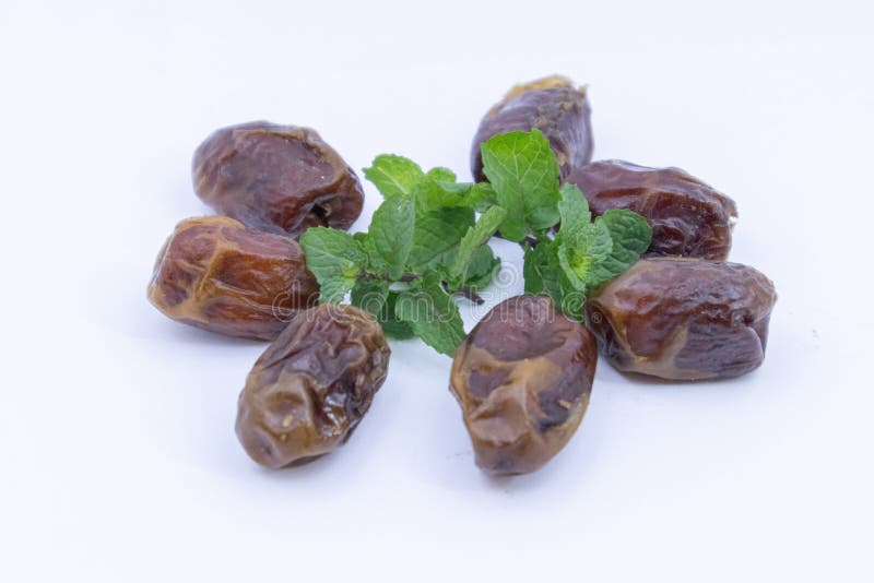 Pile of Dates with Green Leaf Garnish Stock Photo - Image of kurma ...