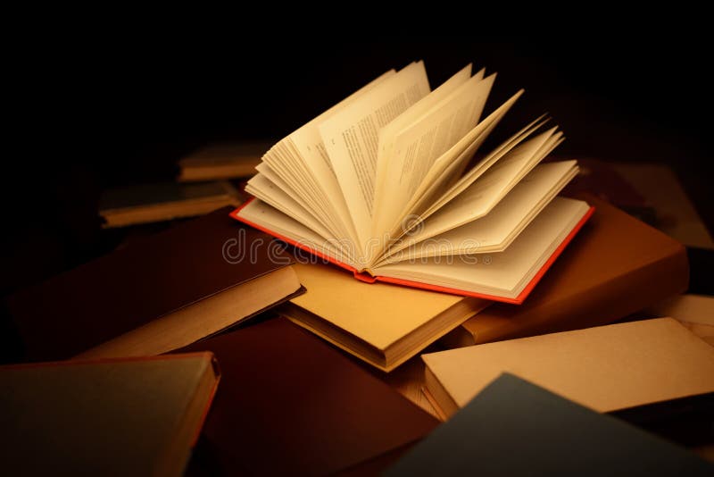 Pile of Different Books with One Open on Top Stock Photo - Image of ...