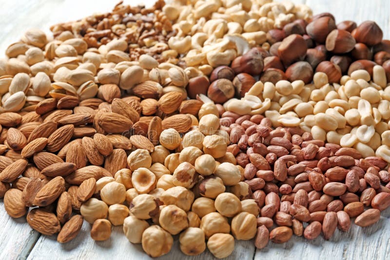 Pile of Different Nuts on Table, Closeup Stock Image - Image of segment ...