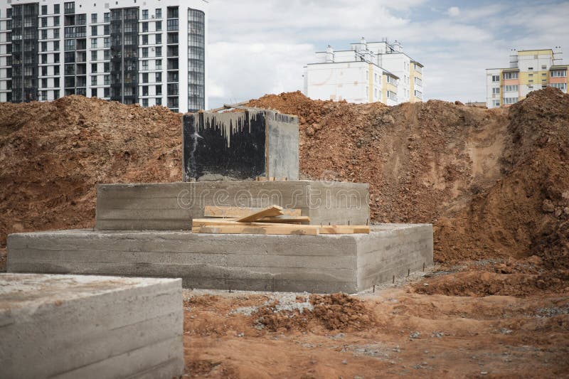 A Pile of Dirt Rests beside a Building Under Construction, Where ...