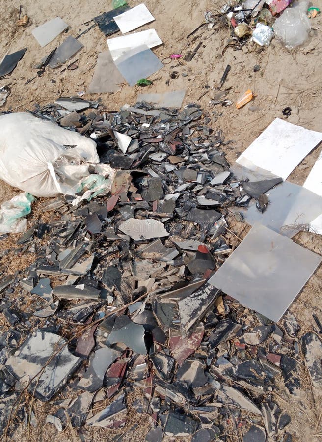 Pile of Discarded Electronic Waste Lying on the Ground, Highlighting ...