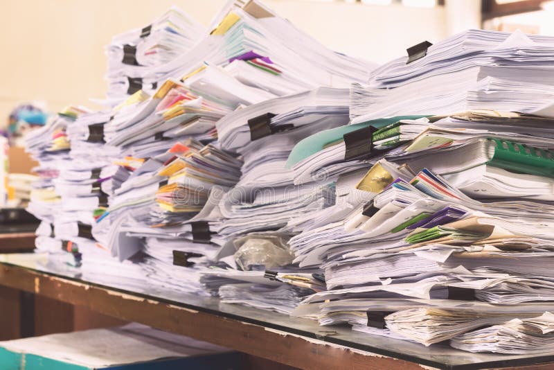 Pile of documents on desk stock image. Image of book - 73804493