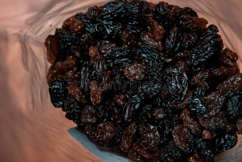 Pile of Dried Raisins in a Transparent Plastic Sack Stock Photo - Image ...
