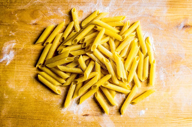 Pile of Dried Spaghetti Pasta on a Board Stock Photo - Image of tube ...