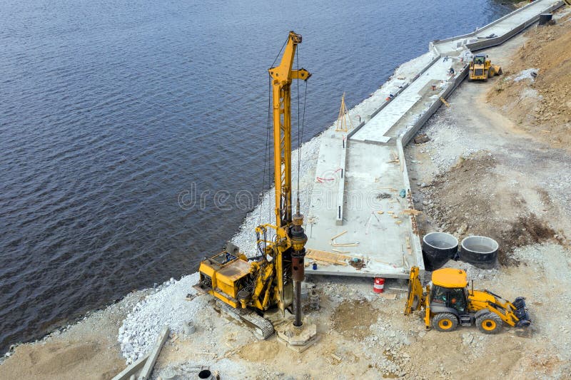 Pile Driver at the Construction of New Embankment on River Bank Stock ...