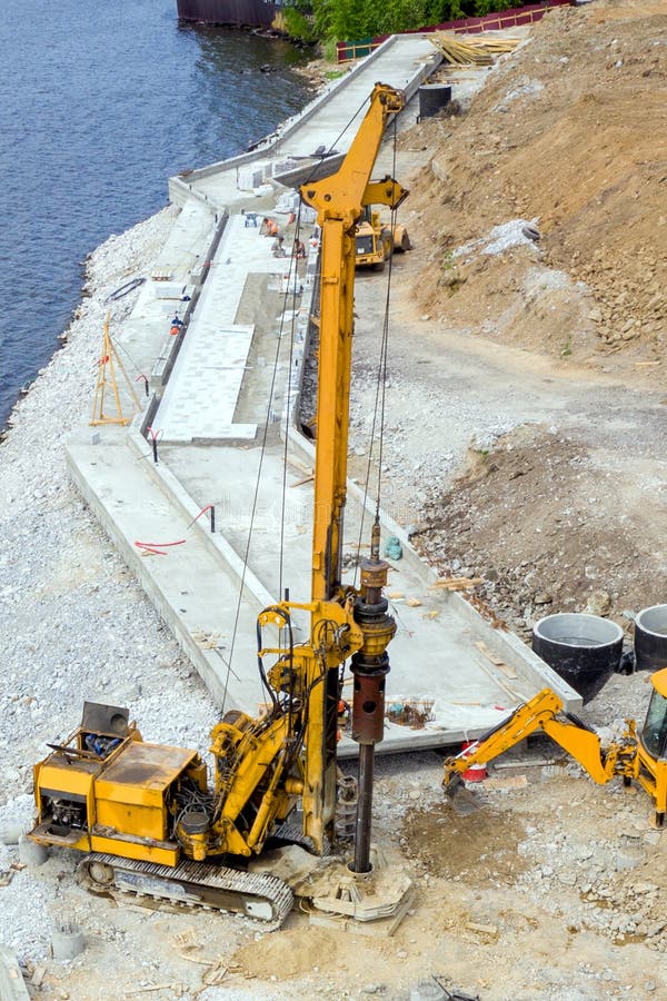 Pile Driver at Construction of New Embankment on the River Bank Stock ...