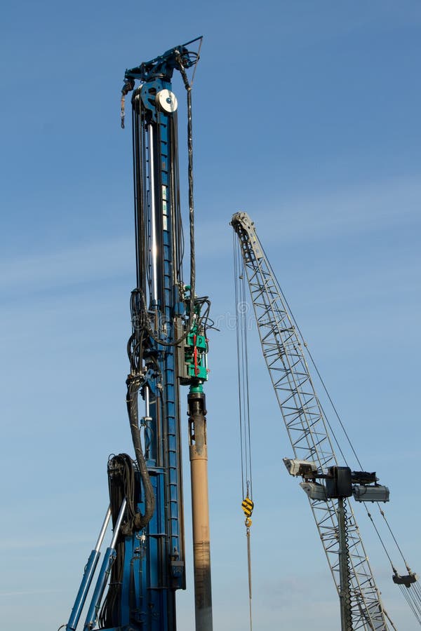 Pile driver and crane. stock photo. Image of hoses, driver - 23990718