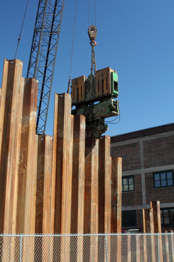 Pile Driver Puts Down Metal Pilings in Preparation for New Build Stock ...