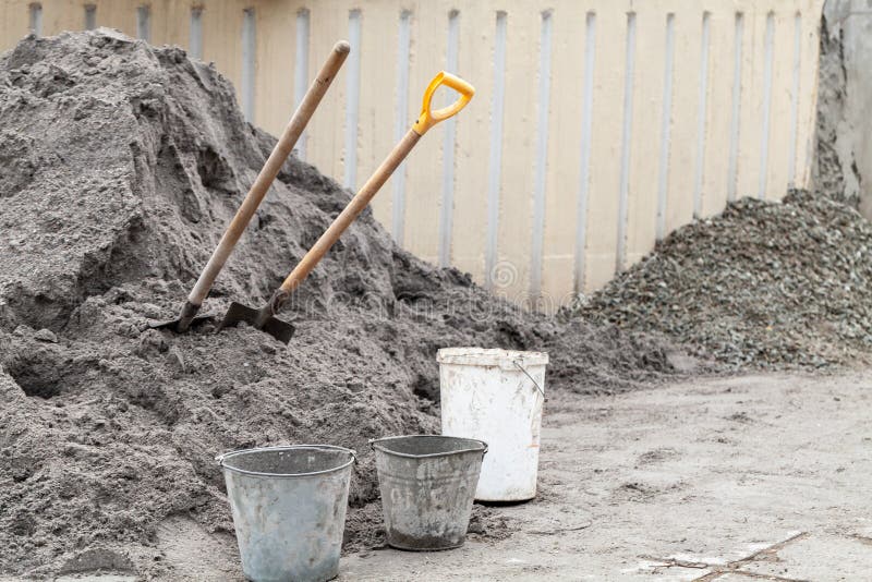 Pile of Dry Cement and Spades Stock Photo - Image of spade, work: 145131708