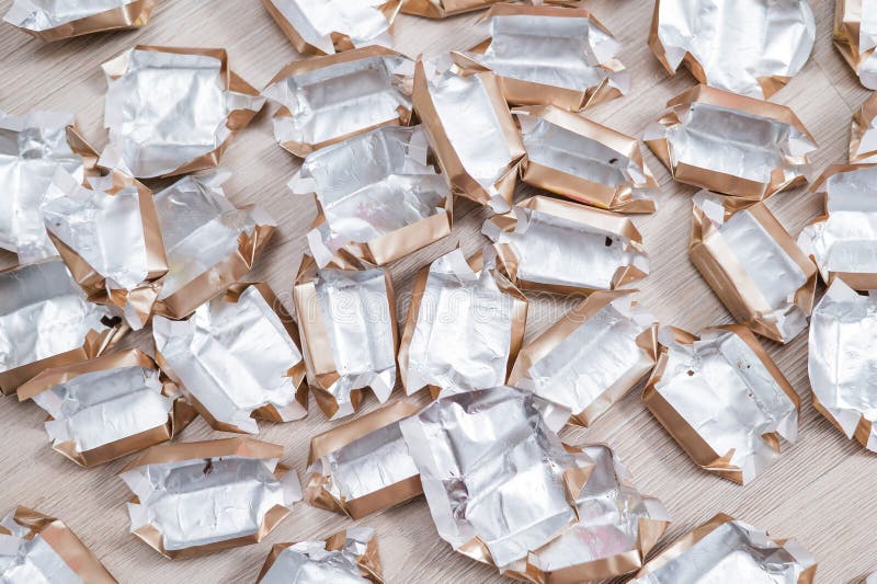 Pile of Empty Silver-gold Candy Wrappers. Top View. Stock Image - Image ...