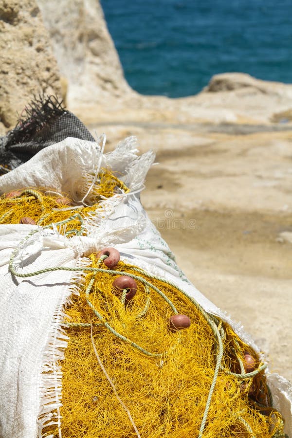 A Pile of Fishing Nets Stored in a Sack Stock Photo - Image of pattern ...