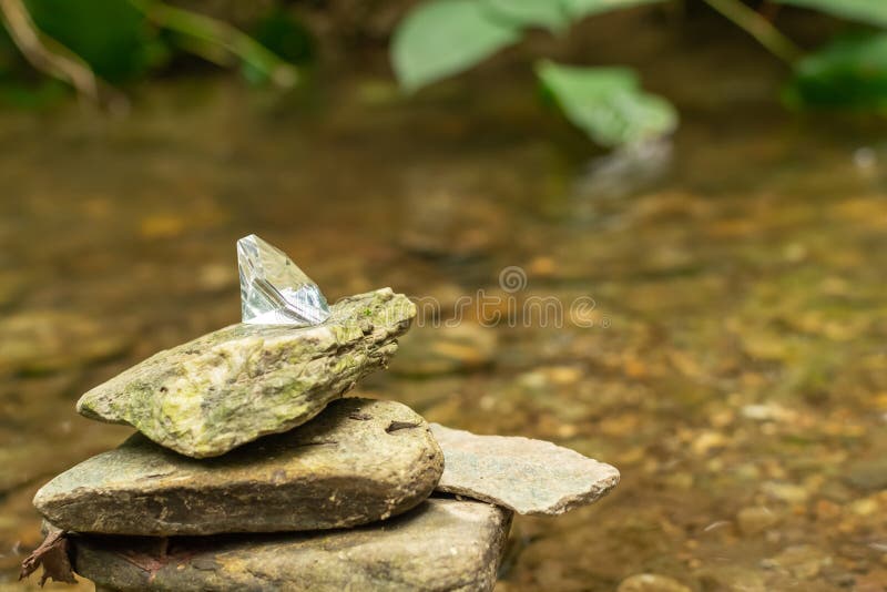Pile of Flat, Sharp Rocks in a Forest with a Precious Diamond on Top of ...