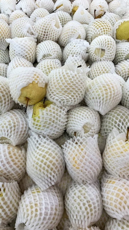 Pile of Fresh Pears Wrapped in White Net Stock Photo - Image of ...