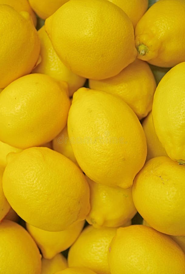 Pile of Fresh Ripe Vibrant Yellow Lemons for Backdrop Stock Photo ...