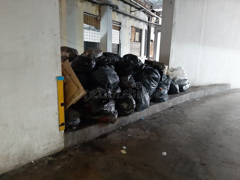 Pile of Garbage in the Corner of the Building Next To the Garbage Can ...