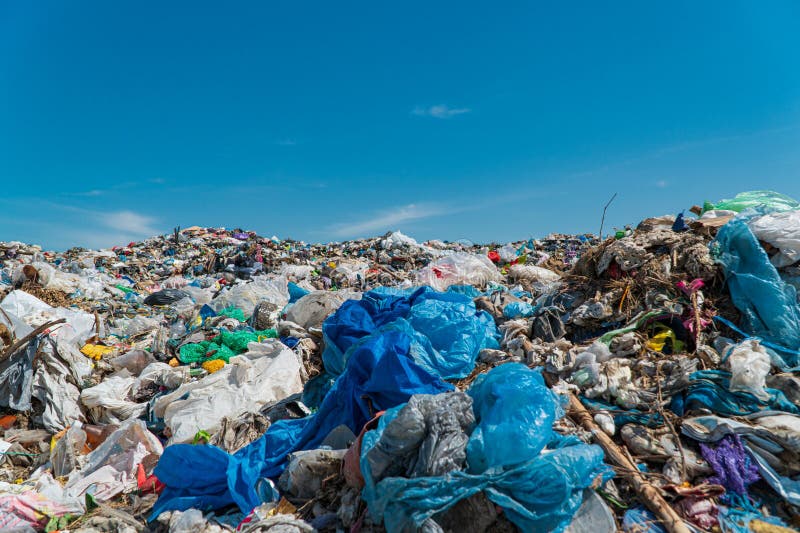 A Pile of Garbage in a Landfill Against a Blue Sky Stock Image - Image ...