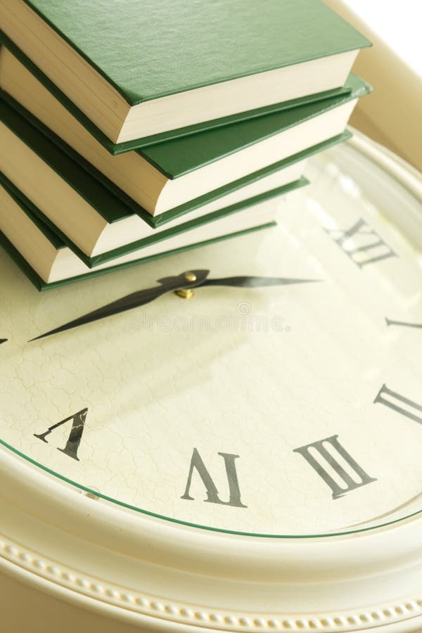 Pile of Green Books on a Clock Table Stock Photo - Image of table ...