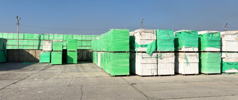 A Pile of Green and White Blocks are Stacked in a Warehouse Stock Photo ...