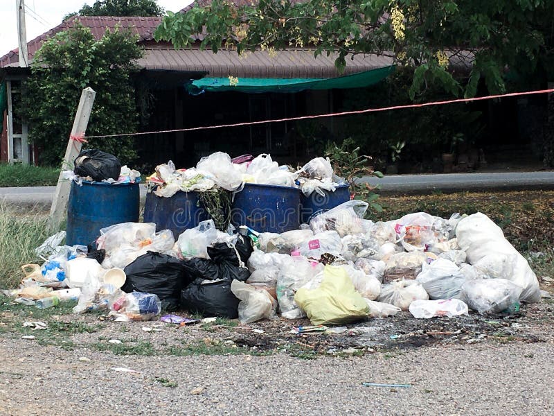 Pile Group of the Garbage Bag on the Ground and Trash Drum beside the ...