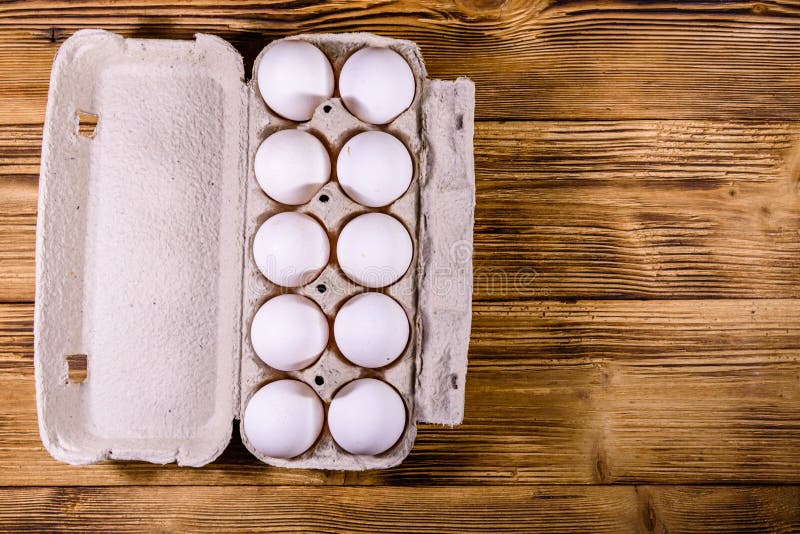 Pile of the Hen Eggs on Wooden Table. Top View Stock Photo - Image of ...