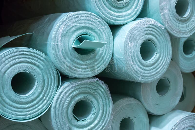 Pile of Insulation Material Rolls. Light Green or Blue Color. Filled ...