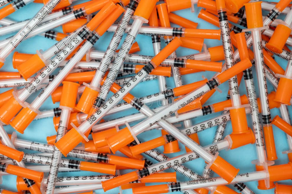 Pile of Insulin Needles with Orange Caps Stock Photo - Image of pile ...