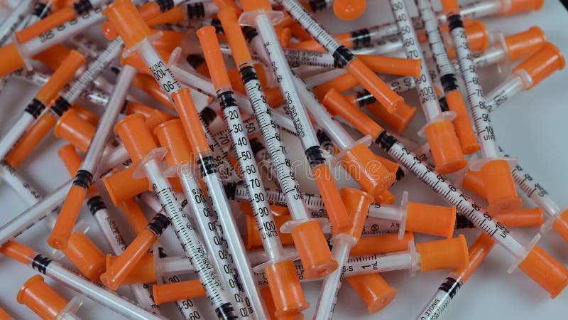 Pile of Insulin Needles with Orange Caps Stock Footage - Video of ...