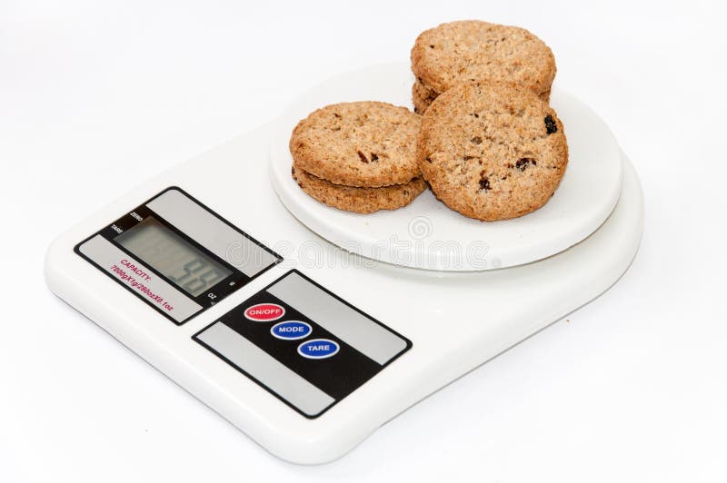 Pile of Integral Cookies on the Digital Kitchen Scale Stock Photo ...