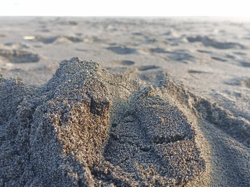 Pile of Iron Sand on the Beach Stock Image - Image of coast, mudflat ...
