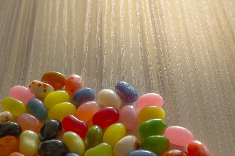 Pile of Jelly Beans Multi Color on Wood Table Stock Photo - Image of ...