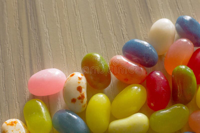 Pile of Jelly Beans Multi Color on Wood Table Stock Photo - Image of ...
