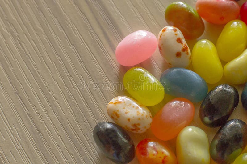 Pile of Jelly Beans Multi Color on Wood Table Stock Photo - Image of ...