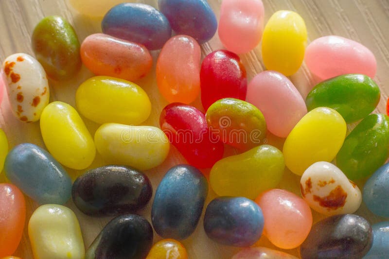 Pile of Jelly Beans Multi Color on Wood Table Stock Photo - Image of ...