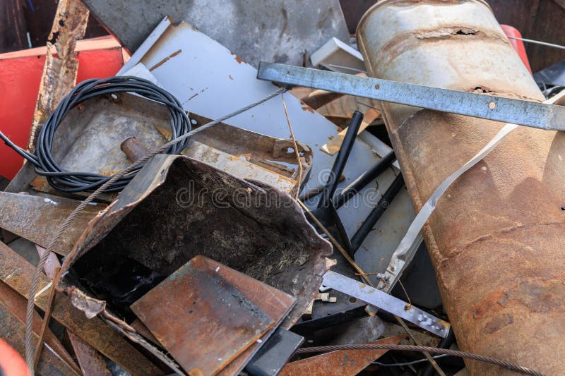 A Pile of Junk Including a Rusty Pipe and a Broken Ruler Stock Photo ...