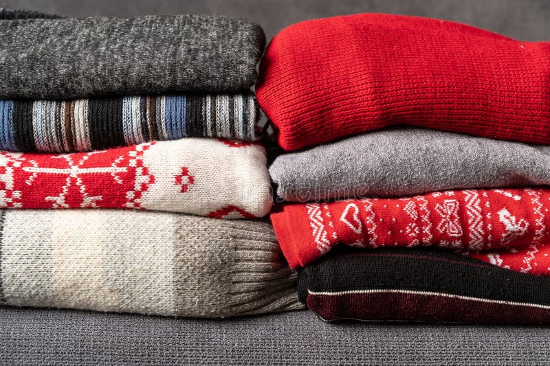 Pile of Knitted Woolen Sweaters Autumn Colors on Wooden Table. Clothes ...