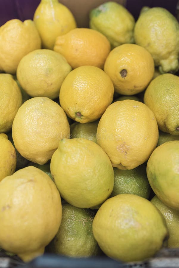 A pile of lemons in a box stock photo. Image of buying - 196588174